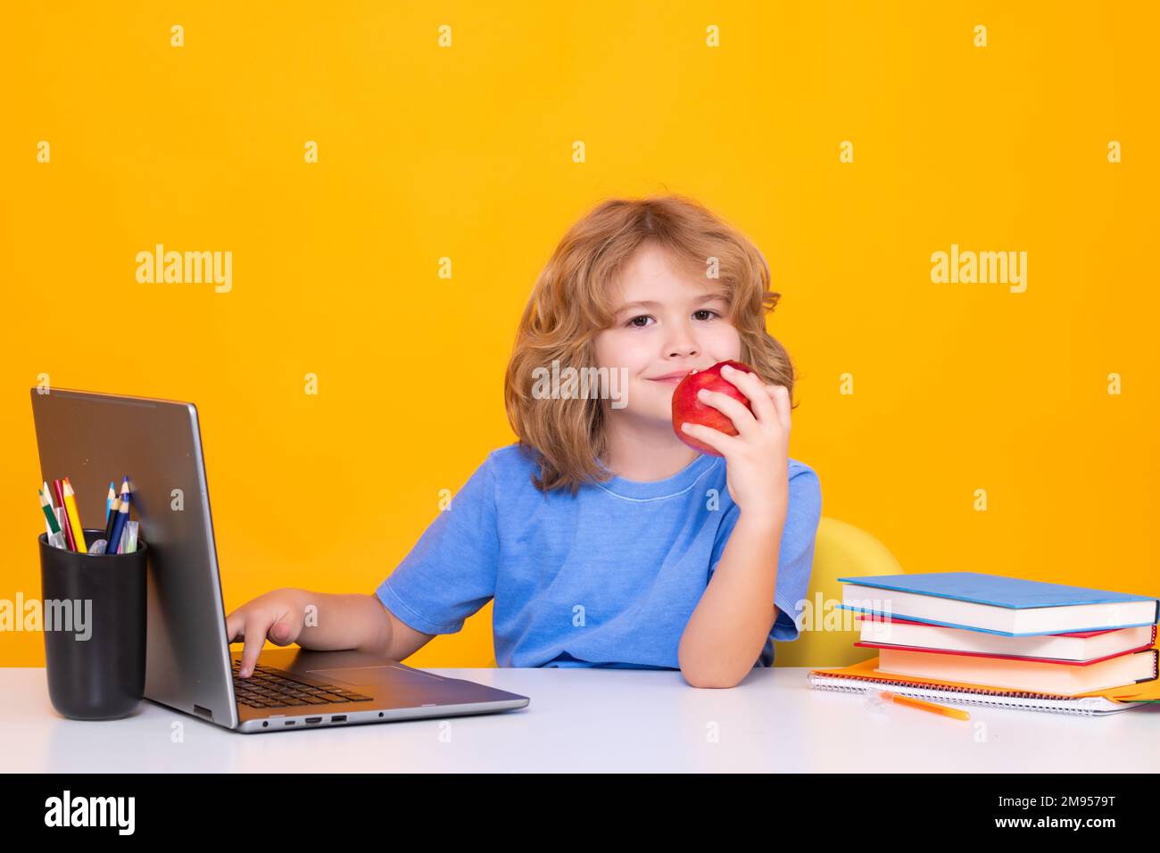 School child using laptop computer. School and kids. Cute blonde child ...