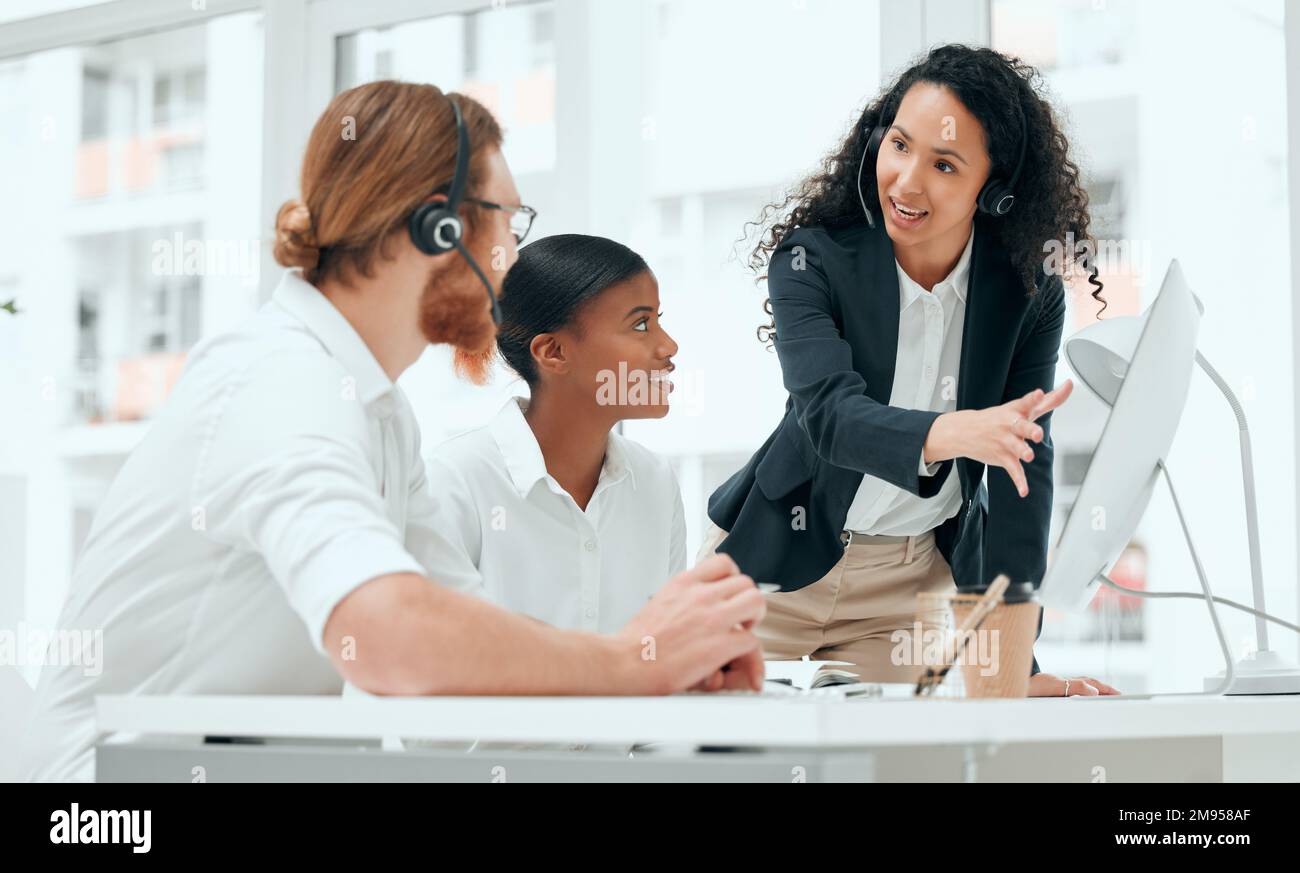 Teaching them all about their support systems. two young call center ...