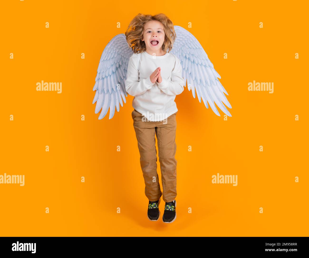 Excited little angel jump, amazed kids jumping. Valentines day. Little ...
