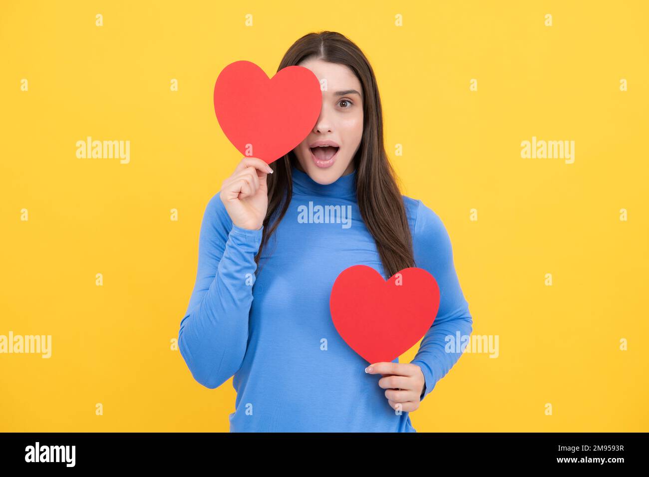 Romantic lovely girl. Happy woman hold red heart. Beautiful female ...