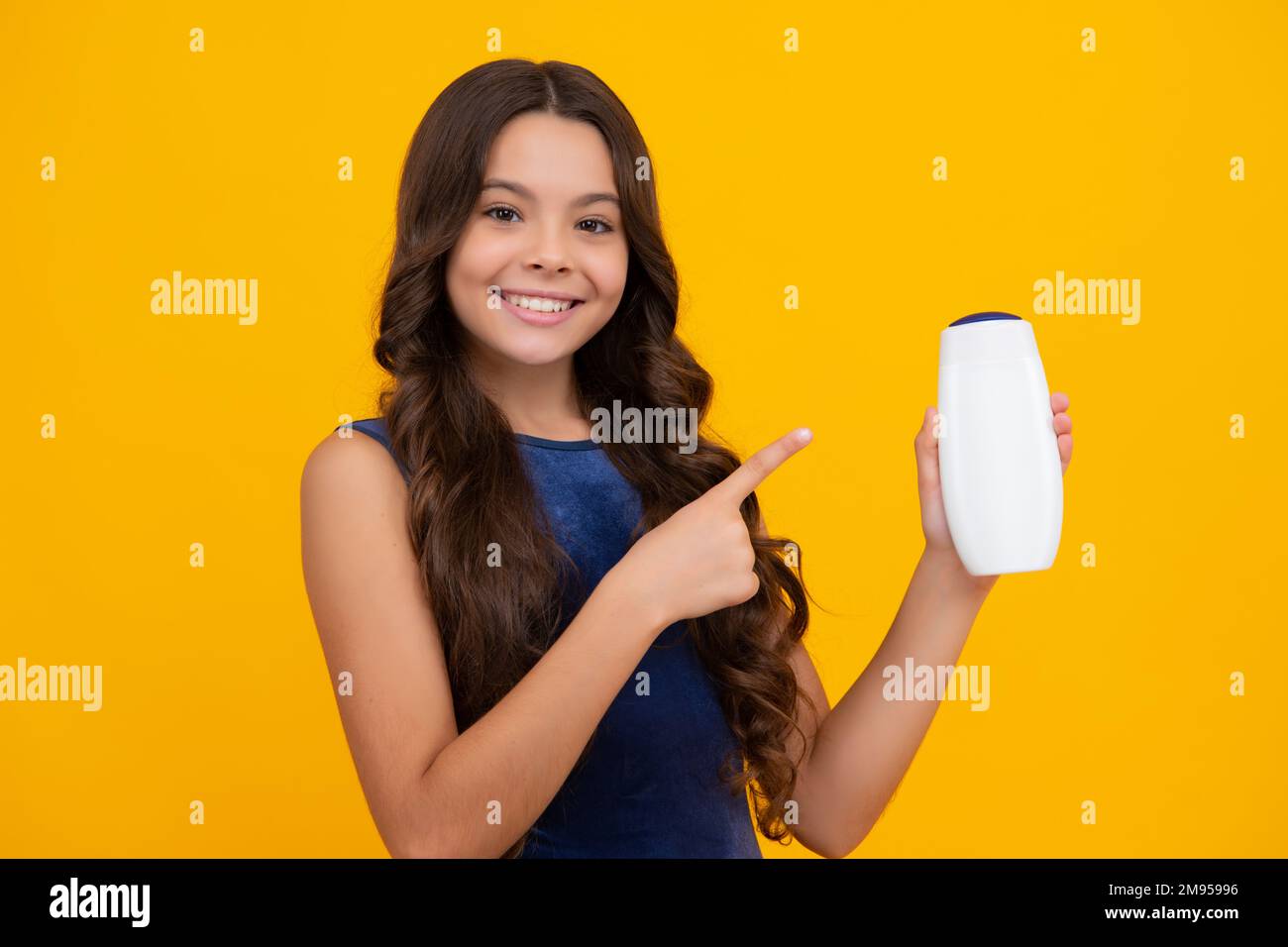 Teenage girl with shampoos conditioners or shower gel. Kids hair care ...