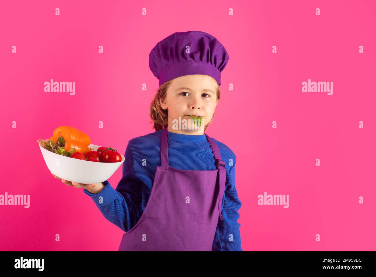 Child cook hold plate with vegetable. Cooking, culinary and kids ...