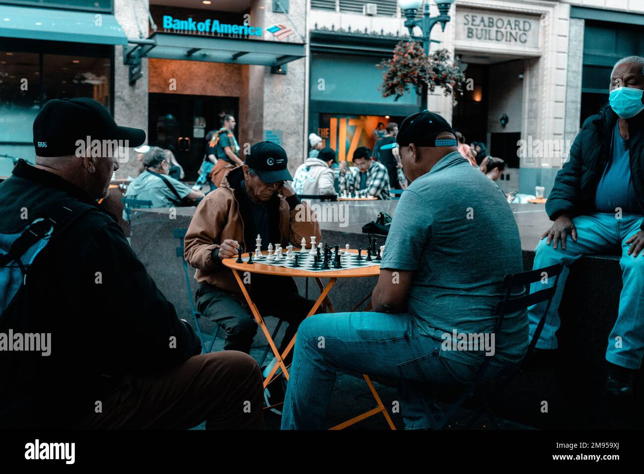 An atmospheric view of old people playing chess on Seattle streets ...