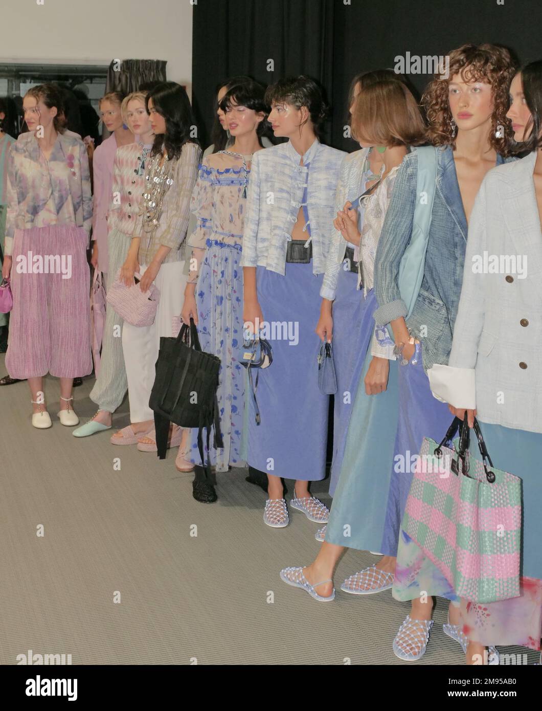 Emporio Armani models backstage before the fashion show in Armani silos ...