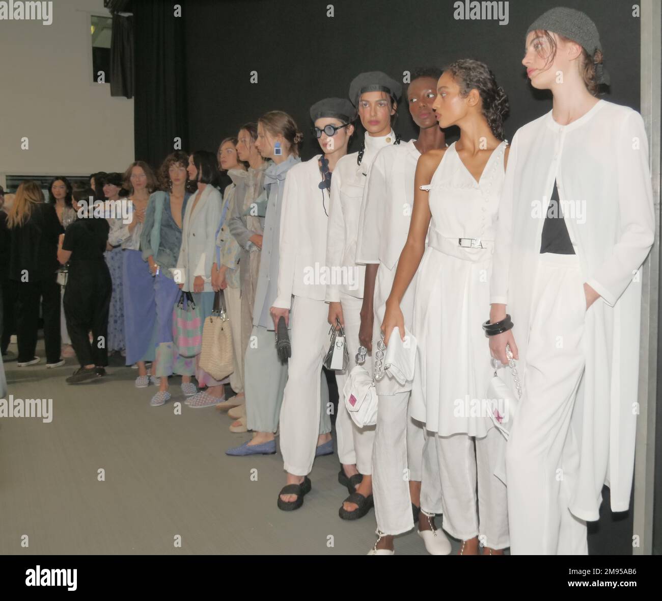 Emporio Armani models backstage before the fashion show in Armani silos ...