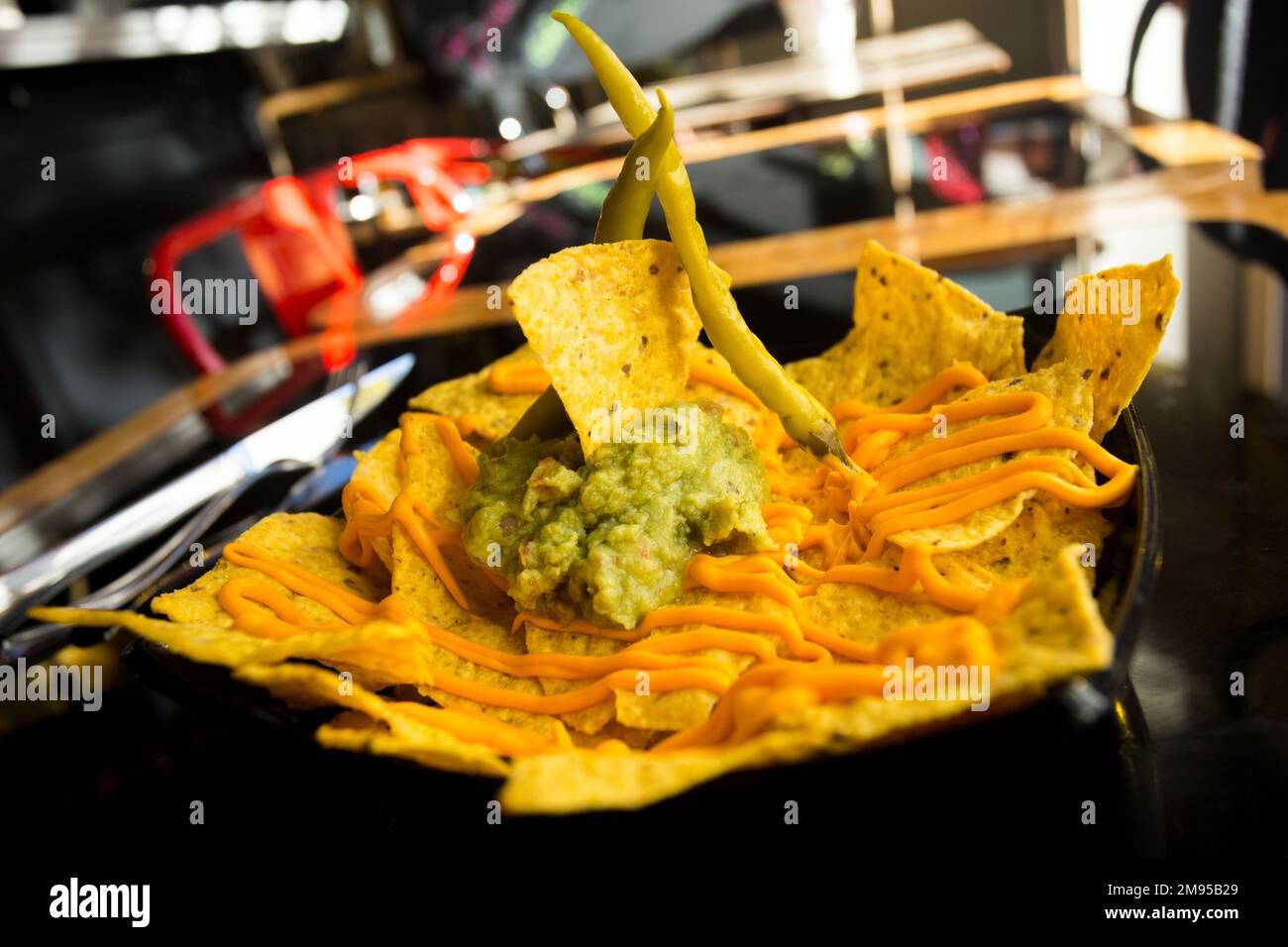 Nachos with guacamole. Nachos are a dish of Mexican origin, which ...