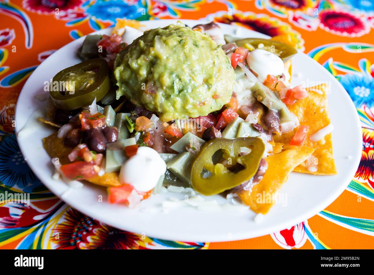 Nachos with guacamole. Nachos are a dish of Mexican origin, which ...