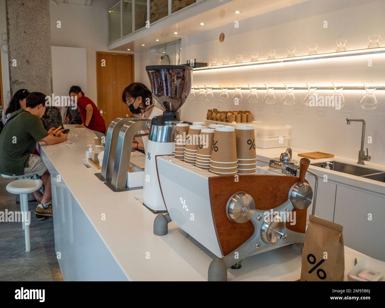 % Arabica Coffeeshop Arab Street baristas wearing face mask Stock Photo ...