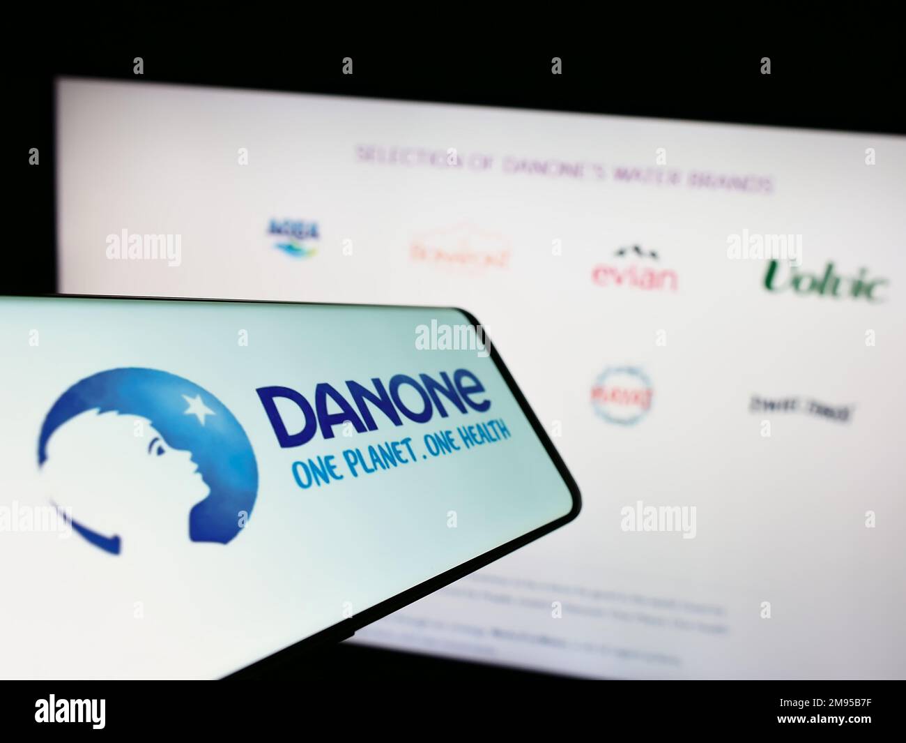 Smartphone with logo of French food company Danone S.A. on screen in ...