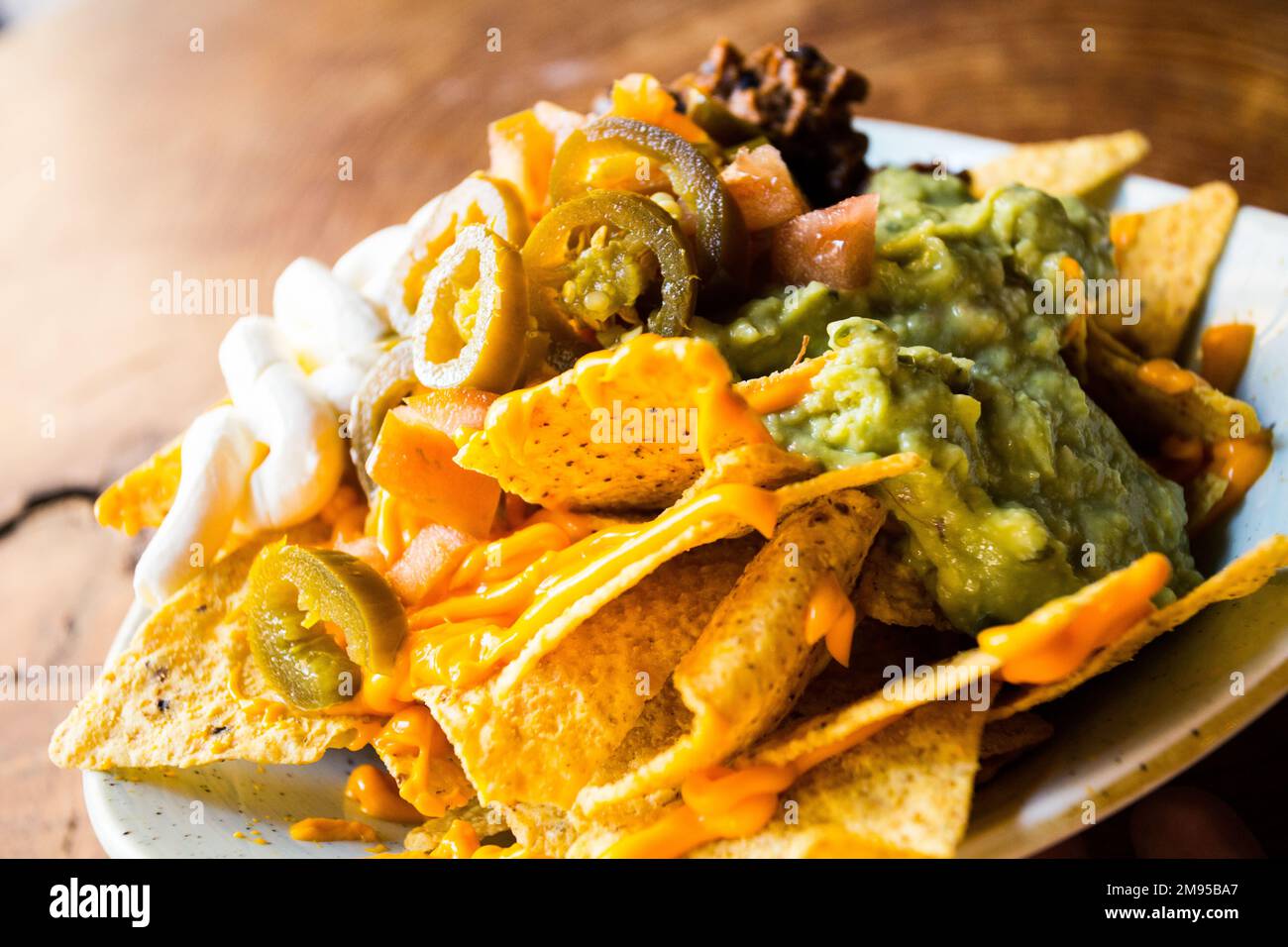 Nachos with guacamole. Nachos are a dish of Mexican origin, which ...