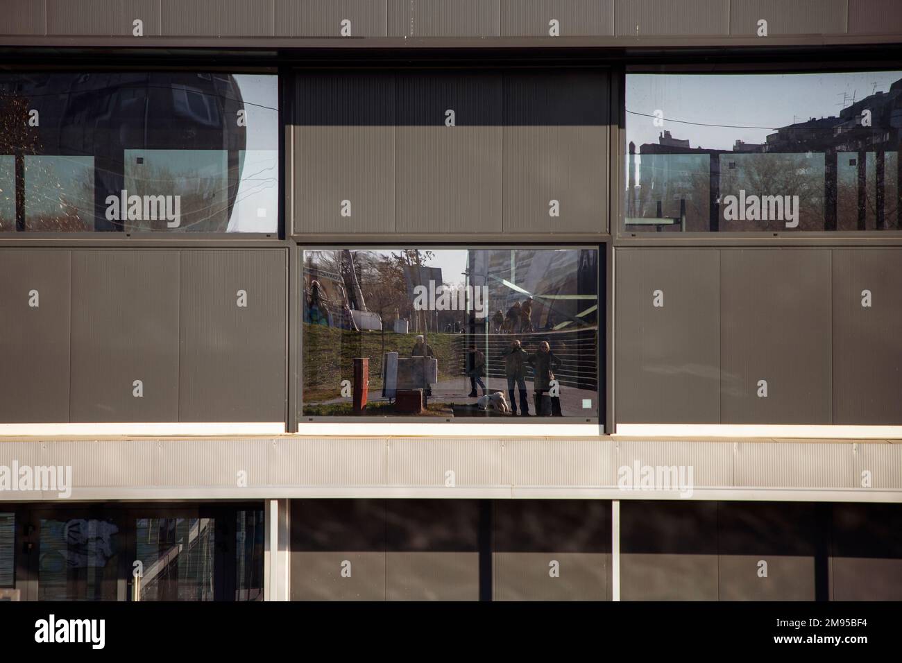 Reflections on the glass surfaces of a building facade Stock Photo - Alamy