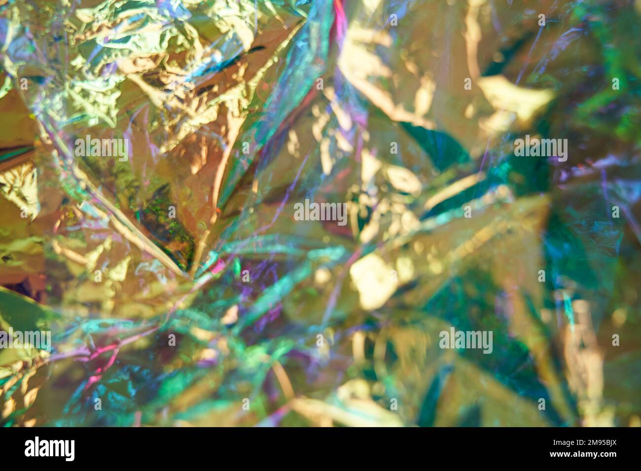 Seamless fashionable iridescent rainbow foil texture. Crumpled ...