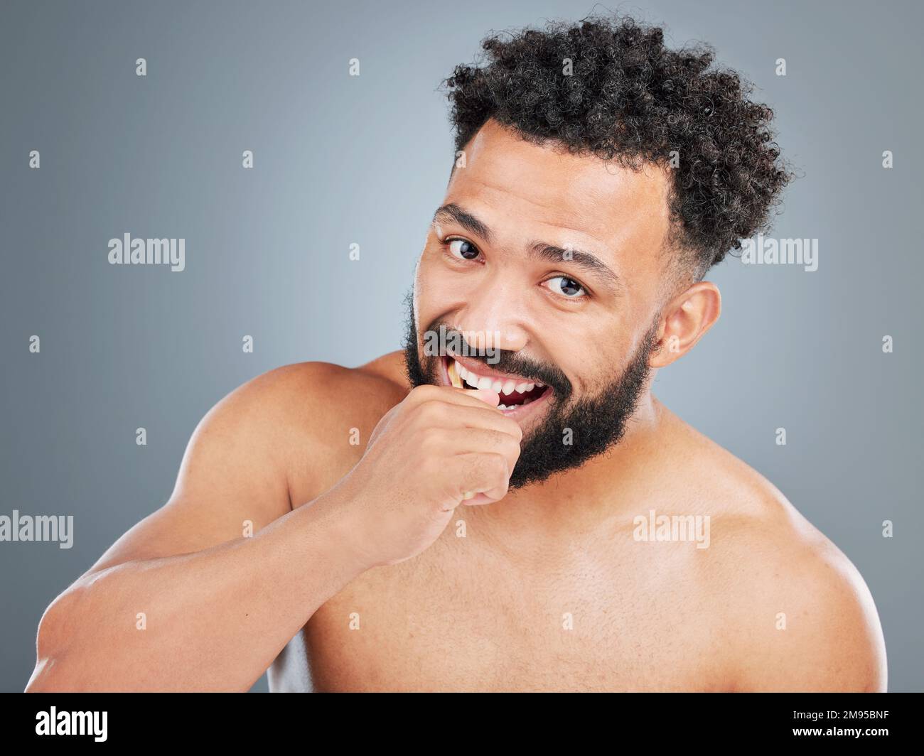 Brightening that smile. Studio portrait of a handsome young man ...