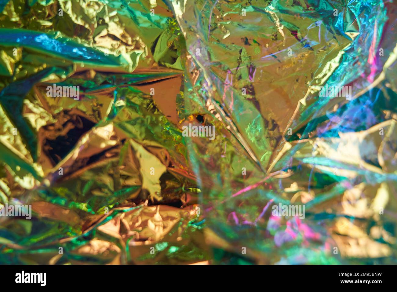 Seamless fashionable iridescent rainbow foil texture. Crumpled ...