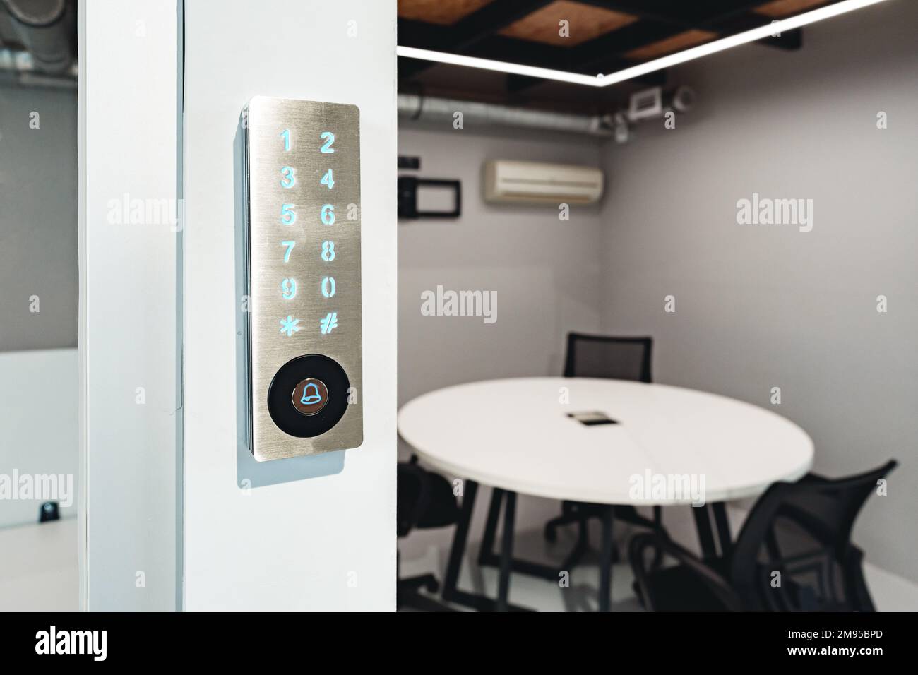 Electronic digital door lock on white office wall Stock Photo - Alamy