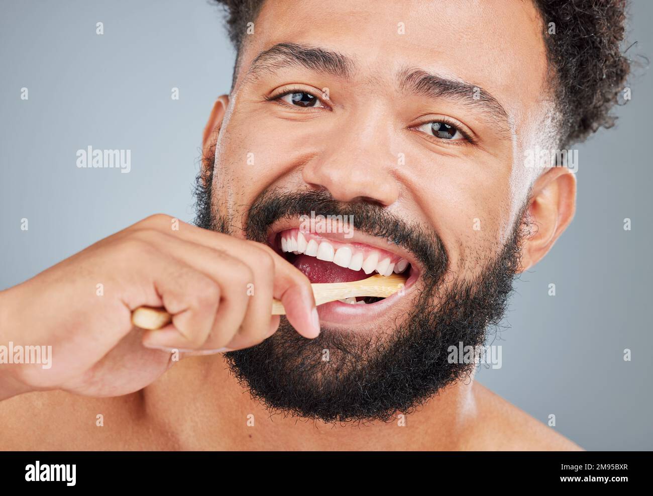 The key to strong teeth and healthy gums. Studio portrait of a handsome ...