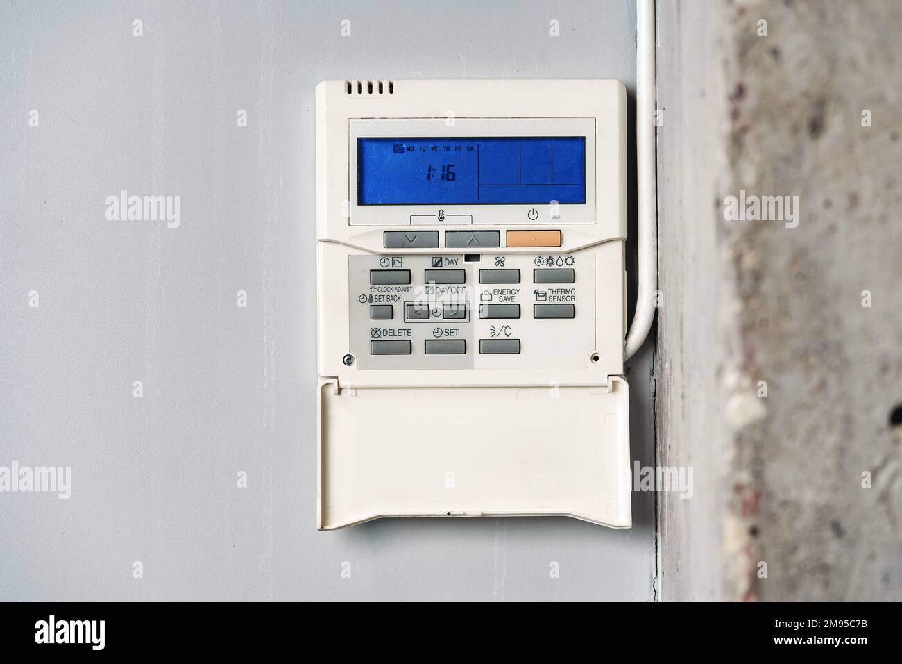 Home security alarm system remote control on the wall Stock Photo - Alamy