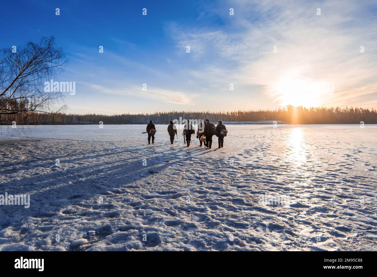 fishermen go on the ice in winter on a Sunny day Stock Photo - Alamy