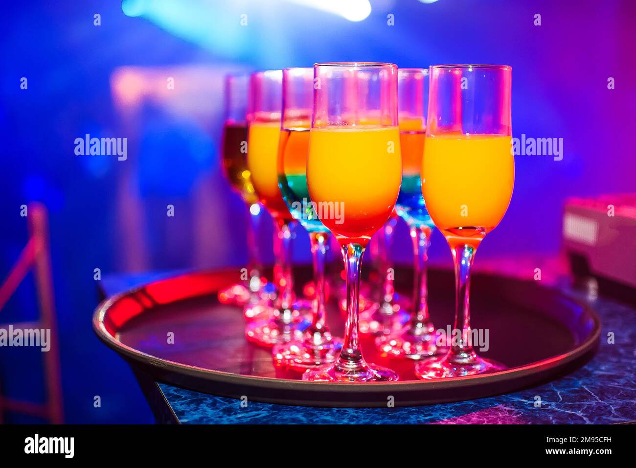 cocktails and alcoholic beverages in glasses at a celebration in the ...