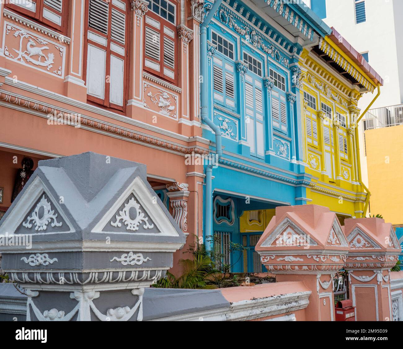 Decorative pier capping of fence in front of Peranakan shophouse on ...