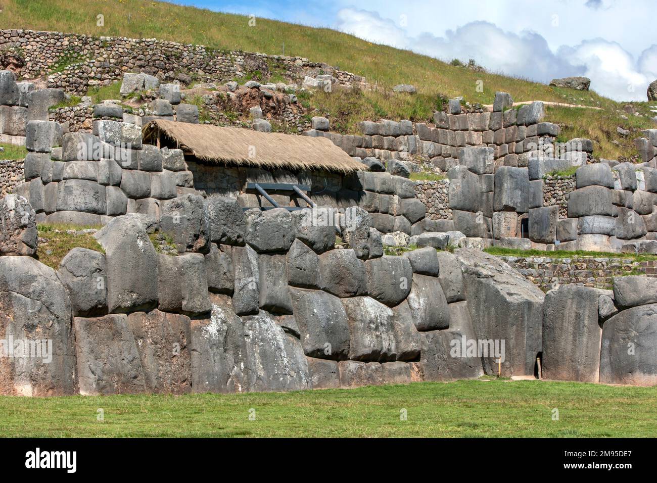 A section of the massive stone walls at Sacsayhuaman built by the Incas ...