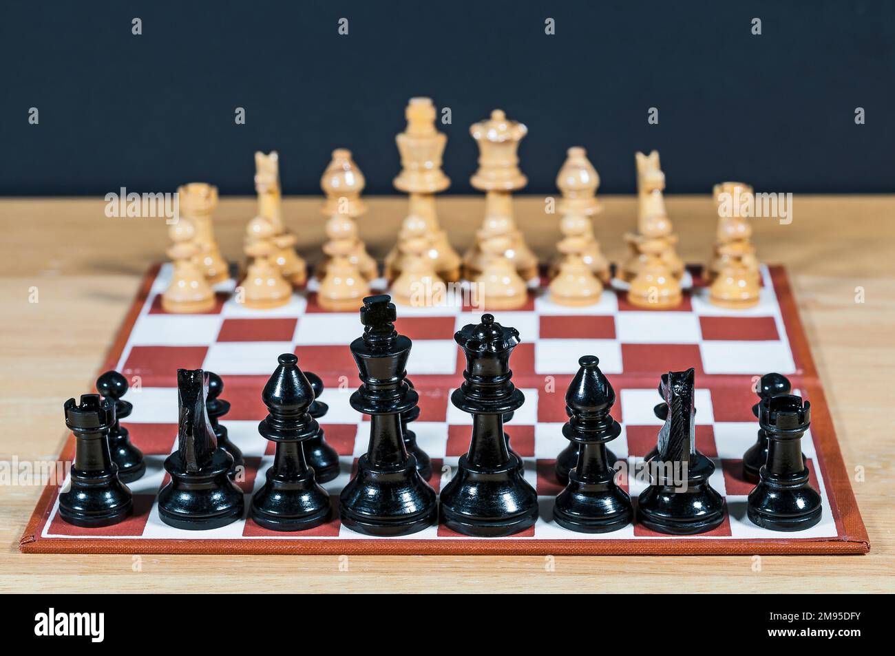 Small Chess Set and Chessboard with far pieces out of focus Stock Photo ...