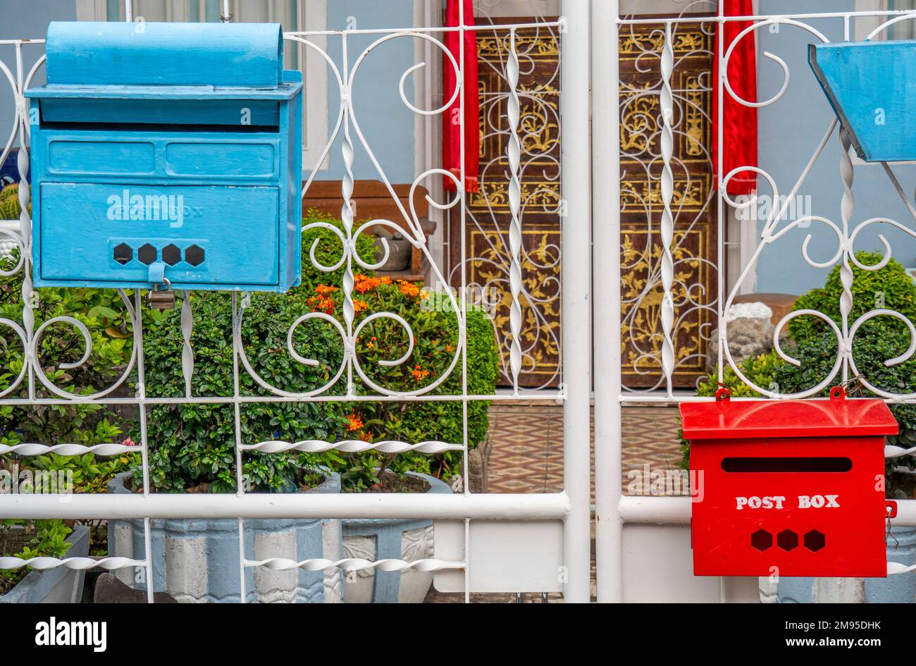 Letterboxes on a gate in front of Peranakan Shophouse on Kooon Seng Rd ...