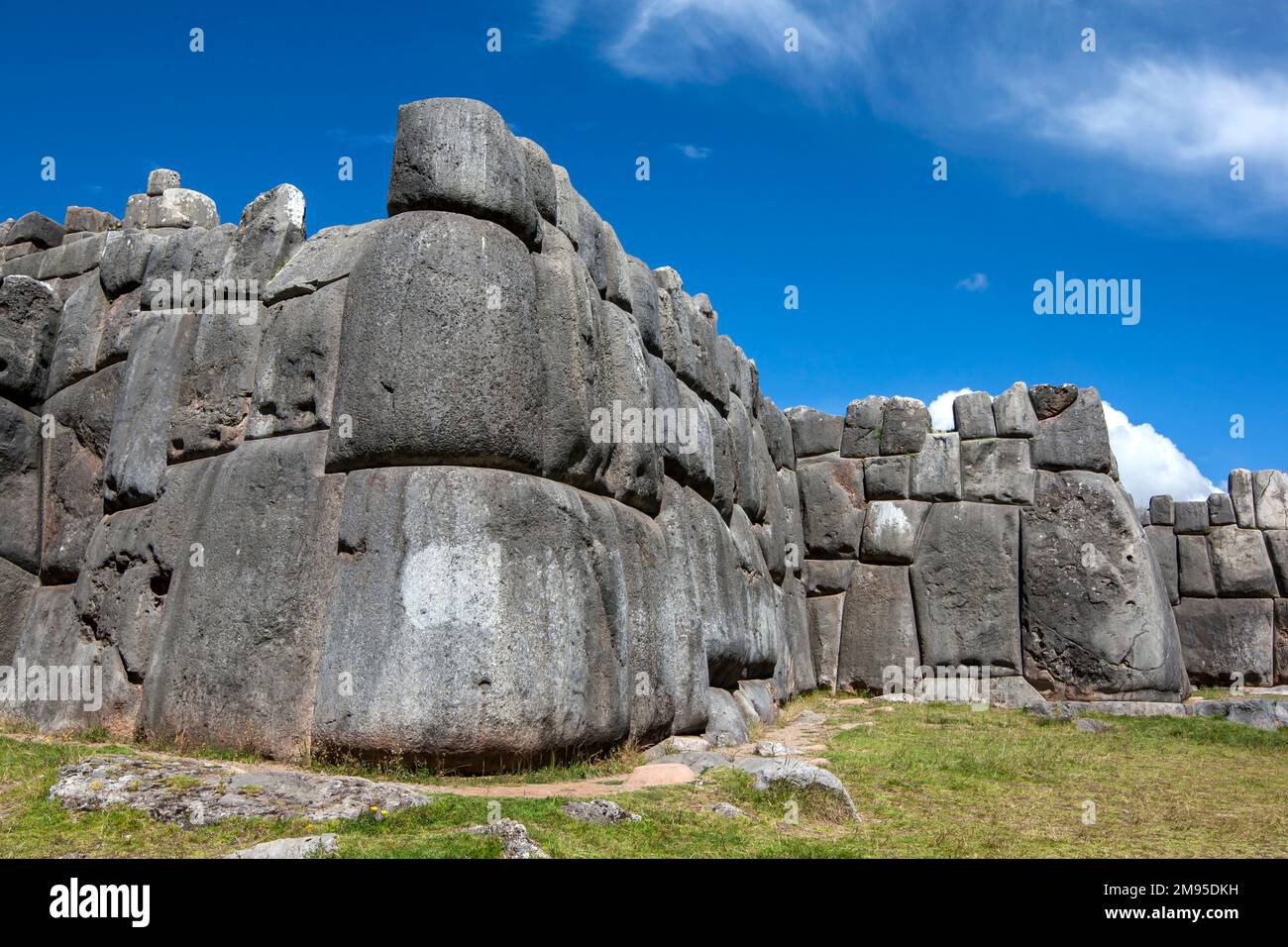 A section of the massive stone walls at Sacsayhuaman built by the Incas ...