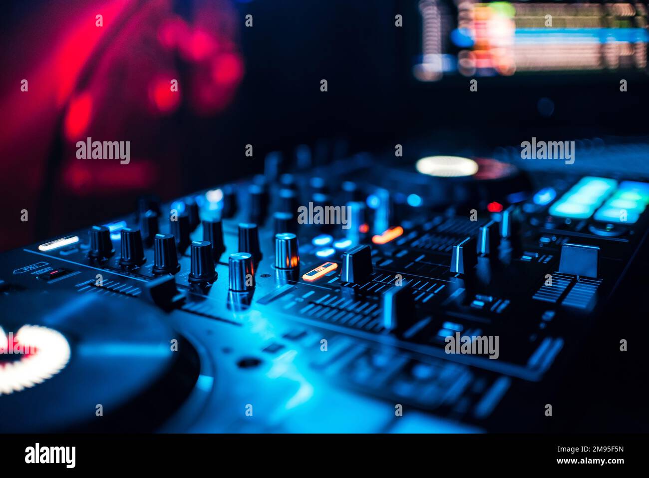 control buttons and mixing music on professional equipment for mixing ...