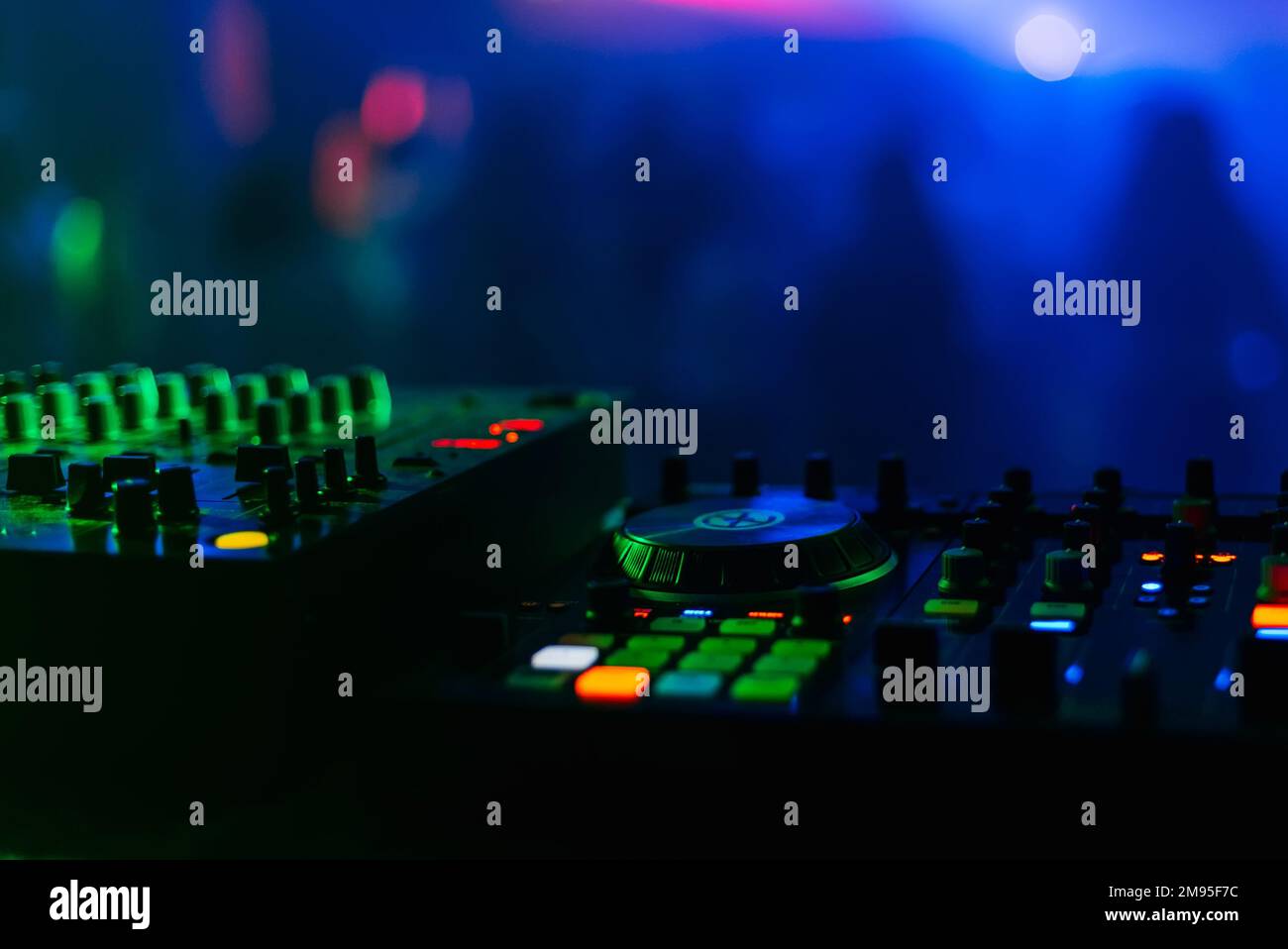 control panel and mixer DJ party night club under colorful lights Stock ...