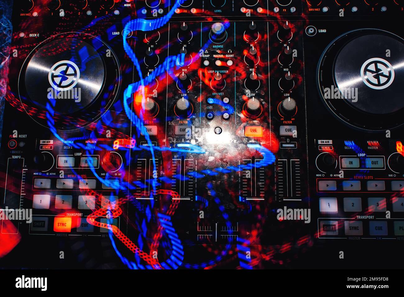 professional DJ Board with mixer for discs with multi-colored traces of light effects with long ...