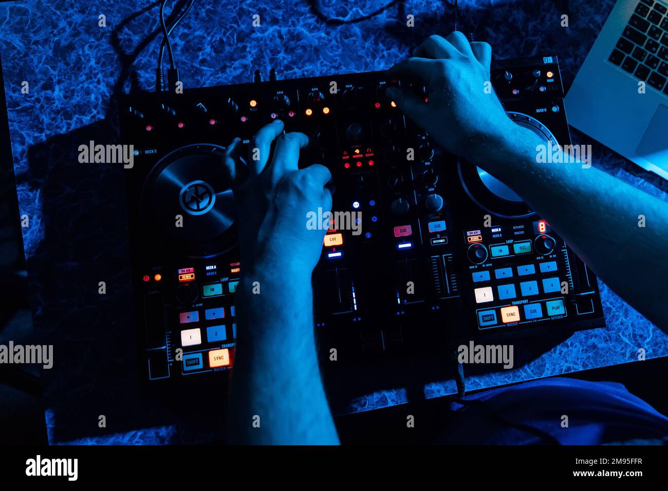 mixer and DJ booth in the nightclub with hands in night club on party ...