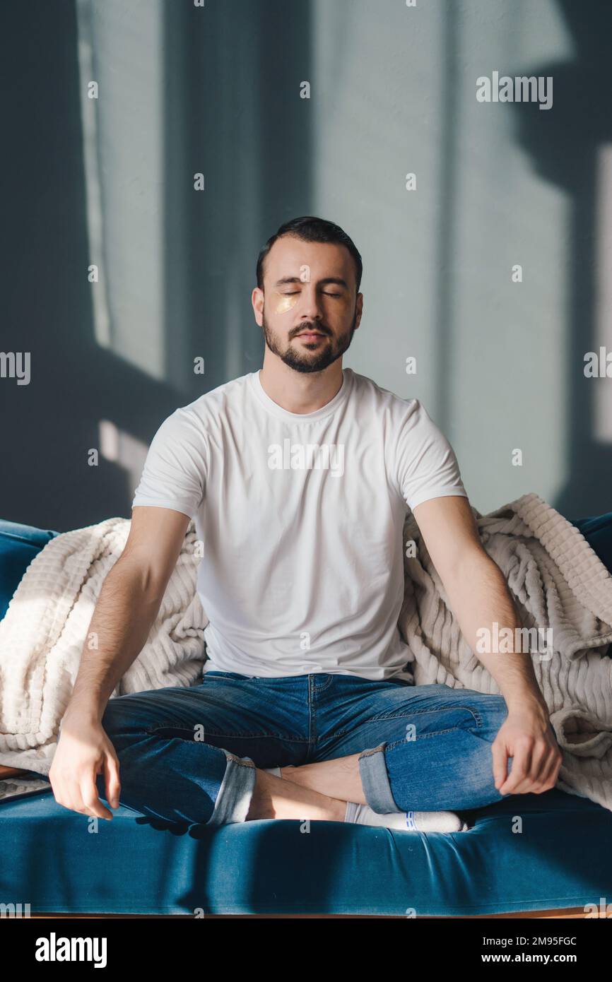 Man couch relaxed pose hi-res stock photography and images - Alamy