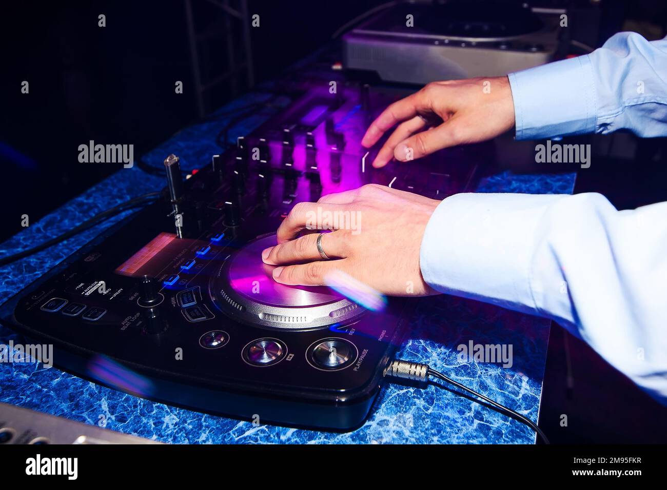 hands of DJ closeup playing music on the club mixer Stock Photo - Alamy