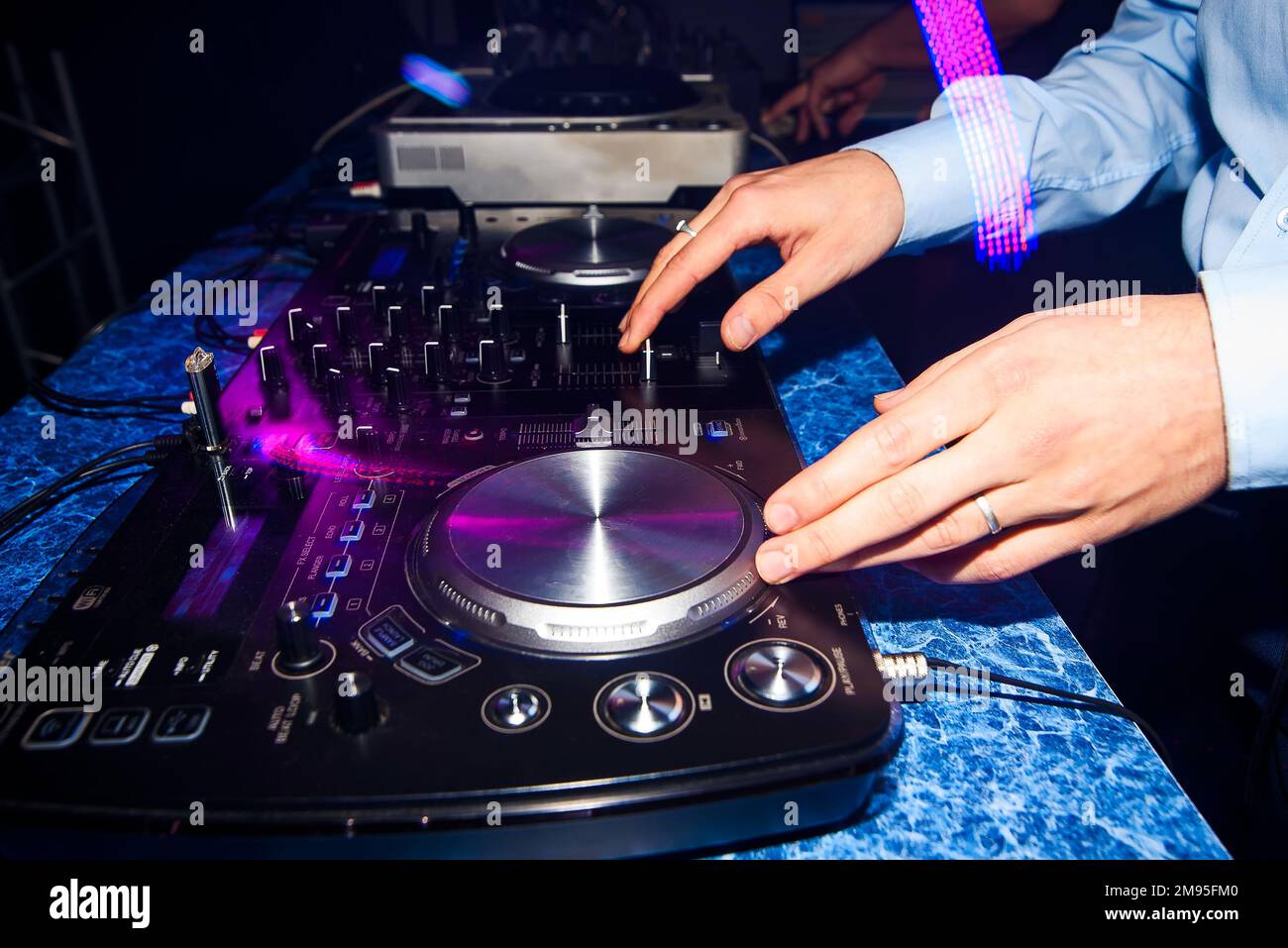 club DJ mixing music on a mixer in nightclub Stock Photo - Alamy