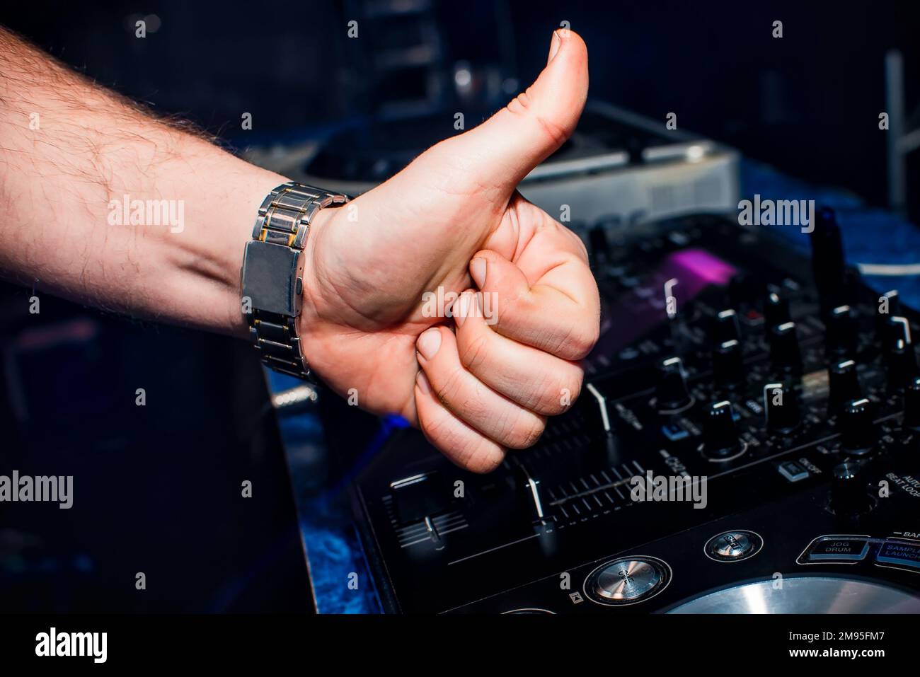 hand of DJ shows the class background of switchers and remote control ...