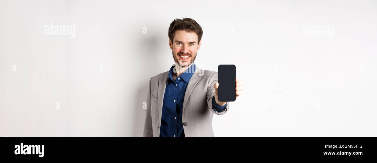 E-commerce and online shopping concept. Confident businessman in suit ...