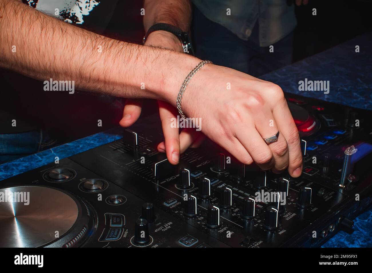 hands of the DJ mixer to play the music in a nightclub Stock Photo - Alamy