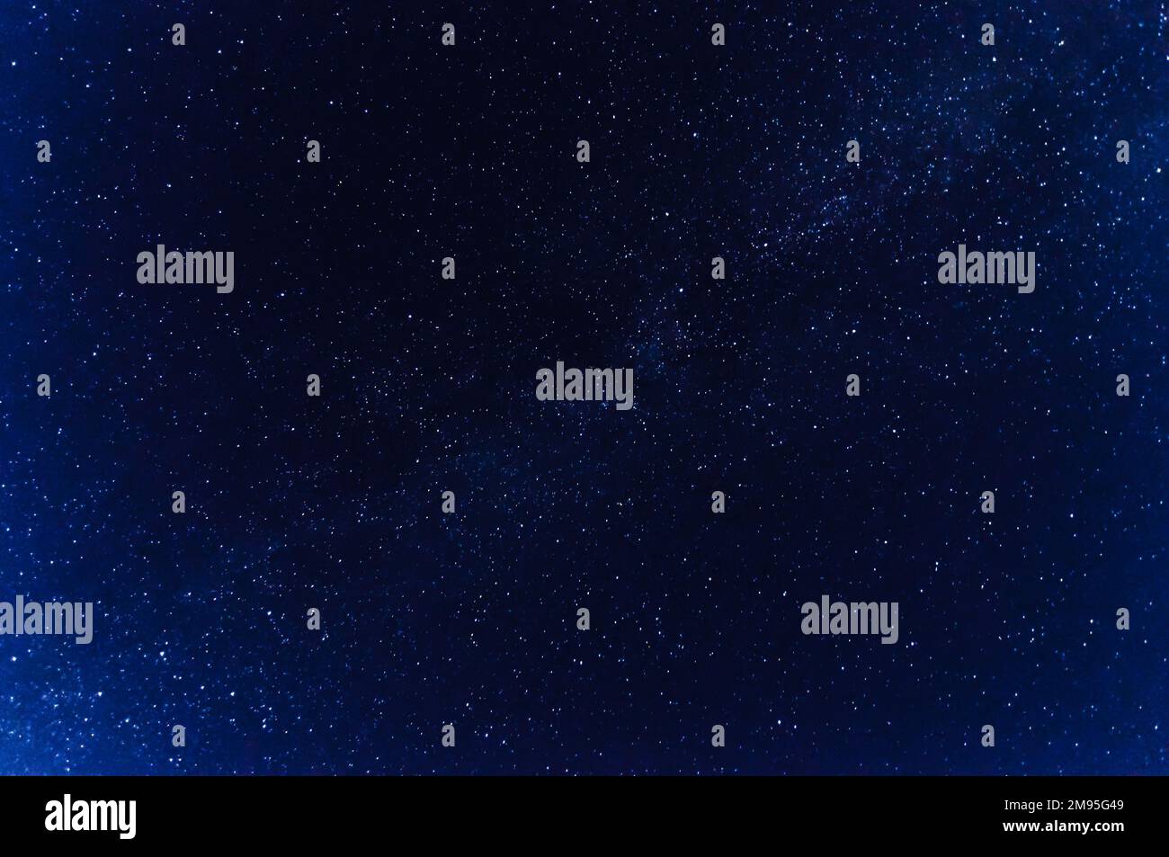 milky way on a blue starry night sky with lots of stars Stock Photo - Alamy