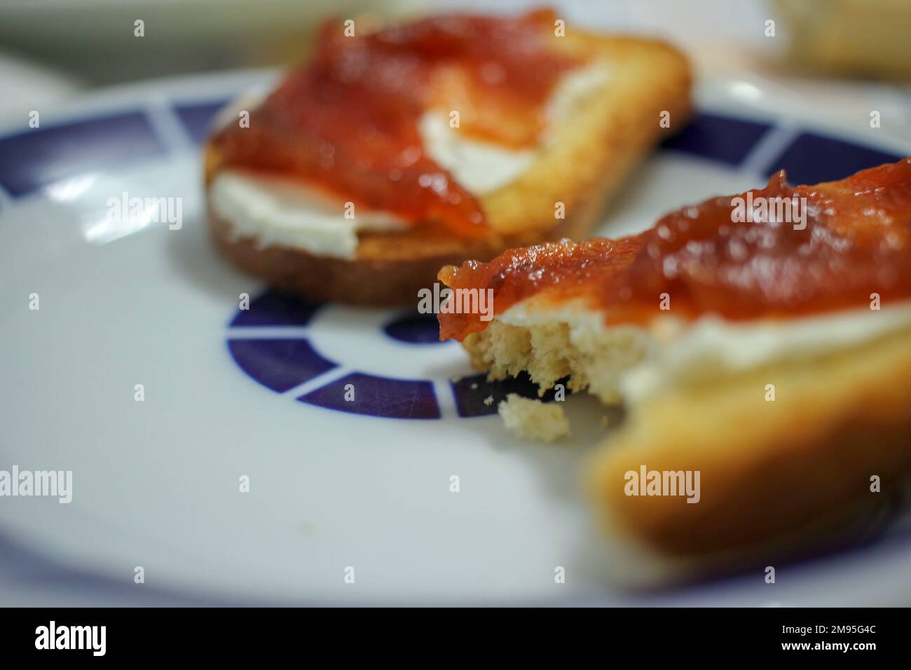 cheese and quince on toasted bread in a dish Stock Photo - Alamy