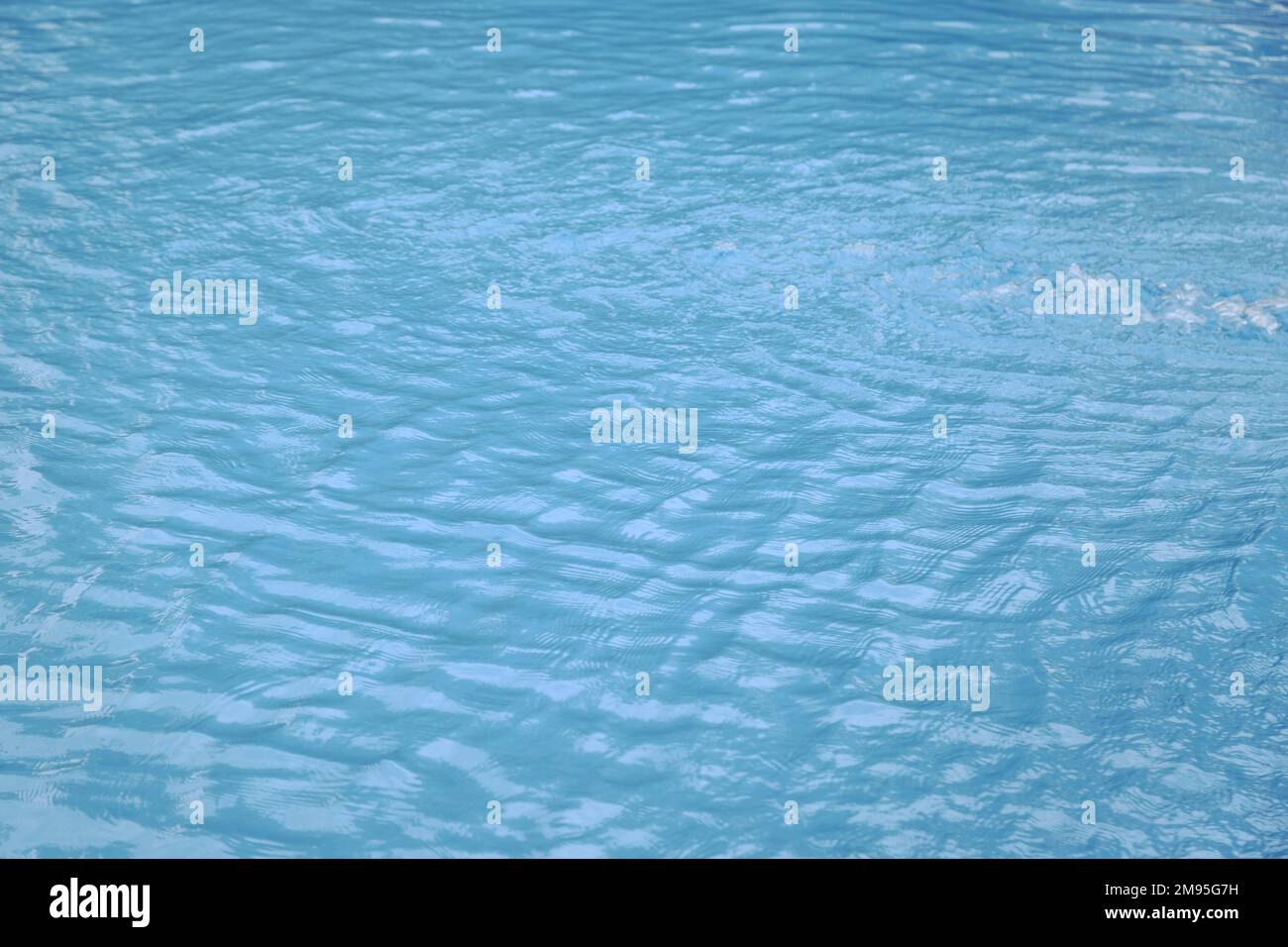 Blue swimming pool edge with refection of water ripple background Stock ...