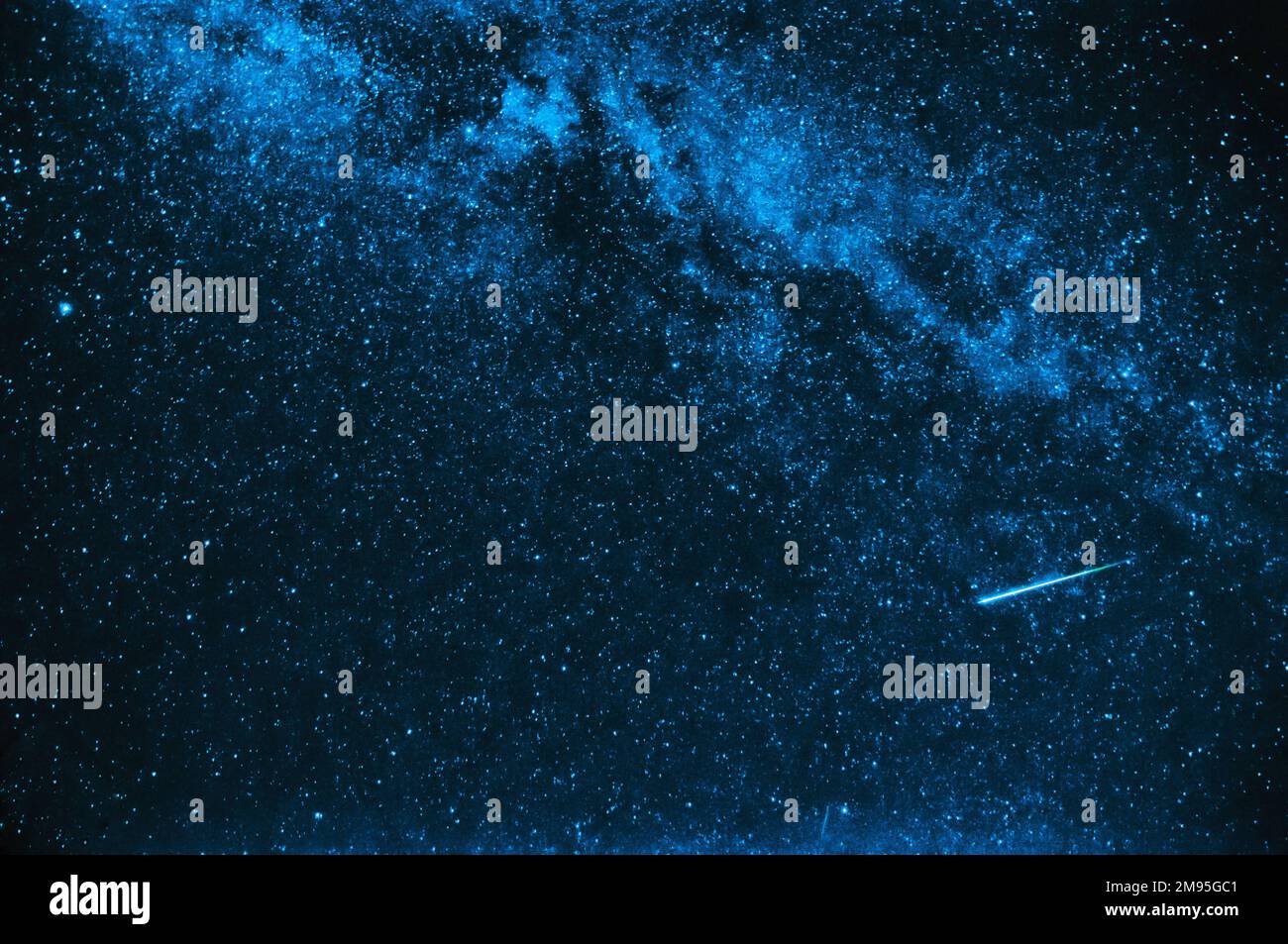 falling star on a background of blue sky with the milky way Stock Photo ...