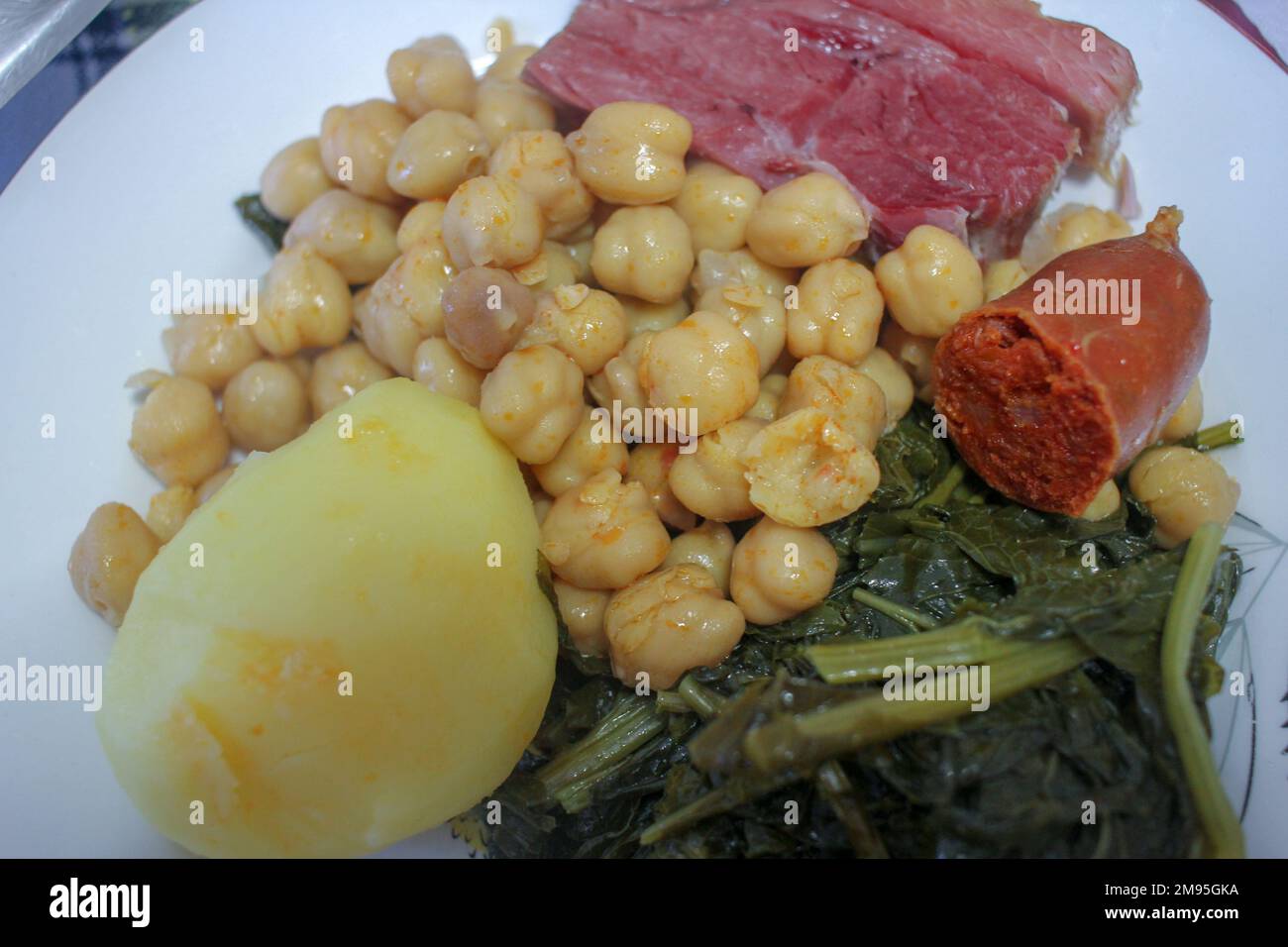 cooked pork legs and marrow with chickpeas made at home is a typical ...