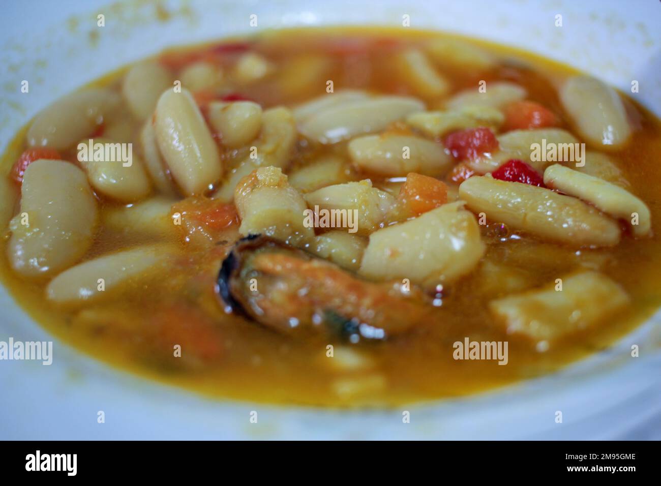 beans with mussels is a healthy dish for lunch Stock Photo - Alamy