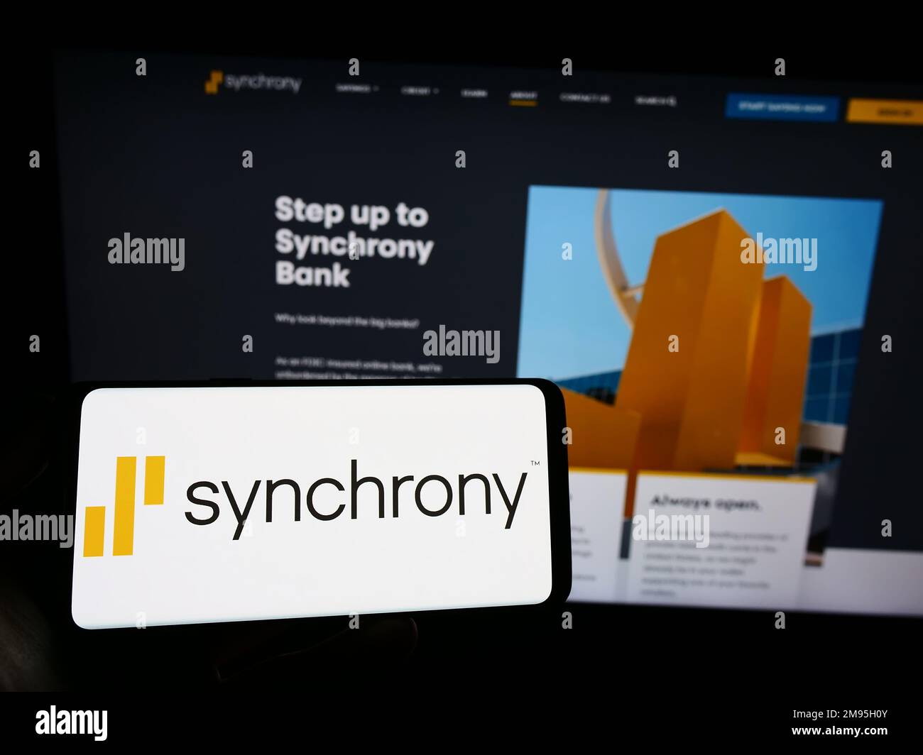 Person holding smartphone with logo of US financial services company ...