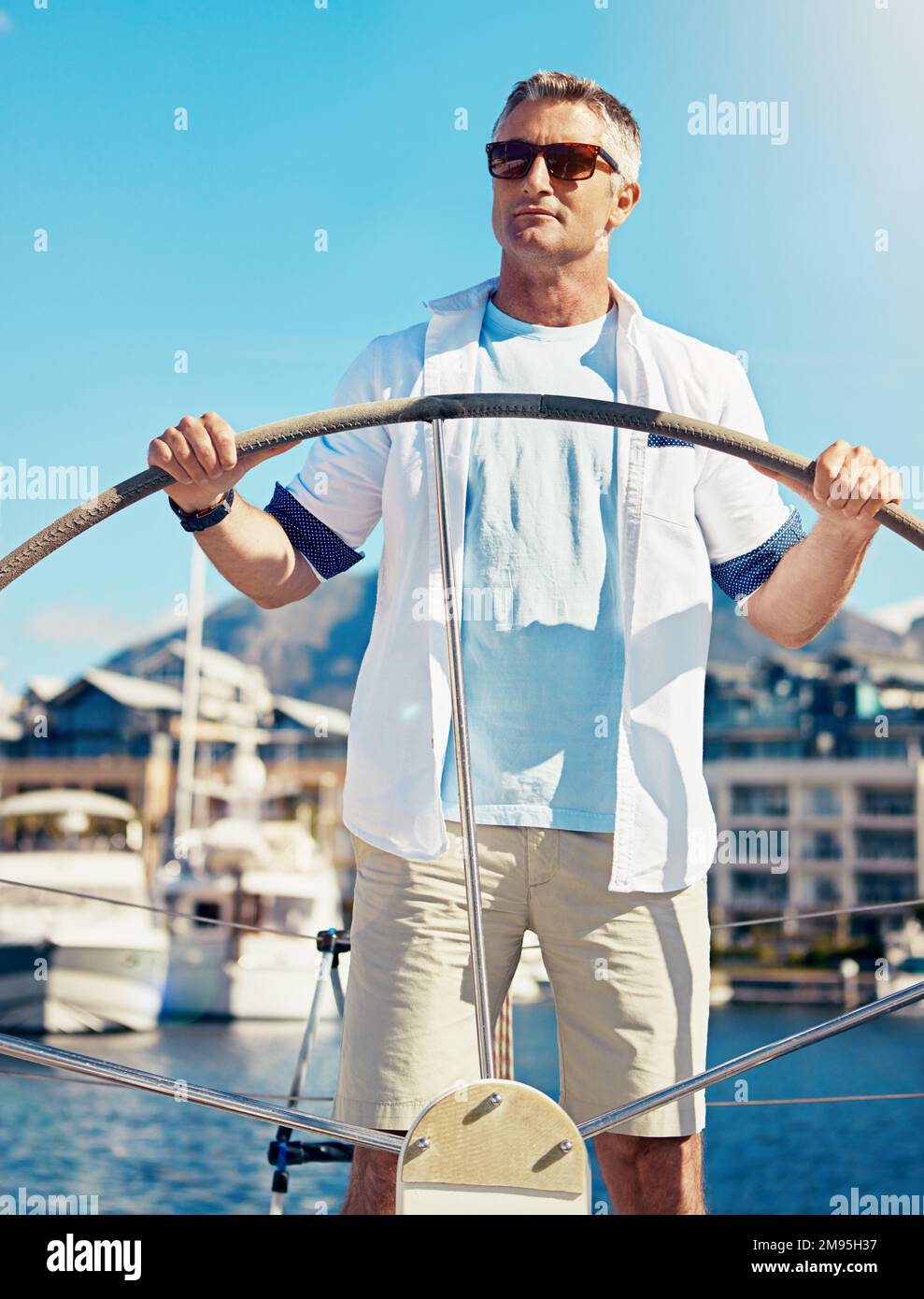Mature man sailing yacht hi-res stock photography and images - Alamy