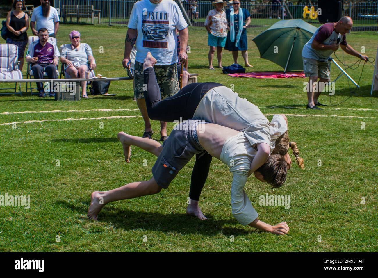 A young teenage girl wrestling with a boy competing in the Grand ...