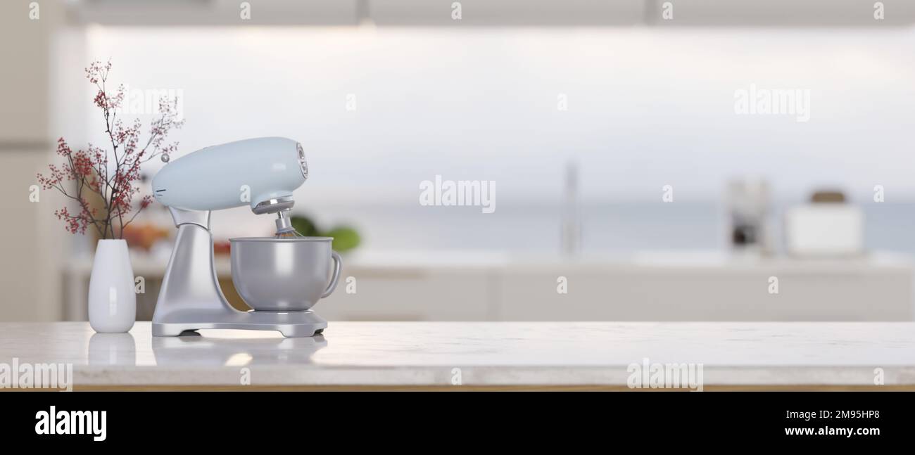 White marble kitchen tabletop with dough mixer machine, flower vase and ...