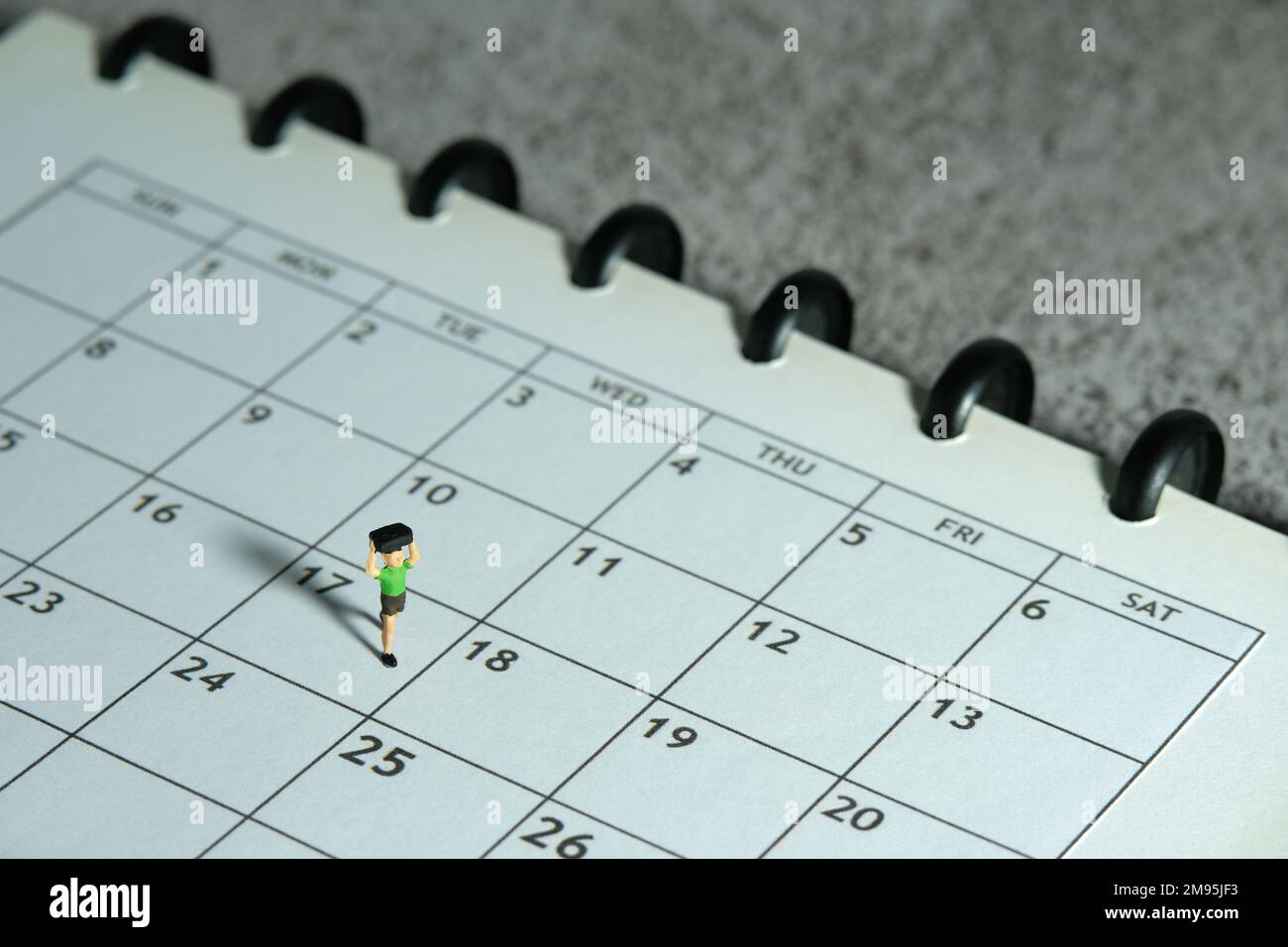 Miniature people toy figure photography. A boy running above monthly ...