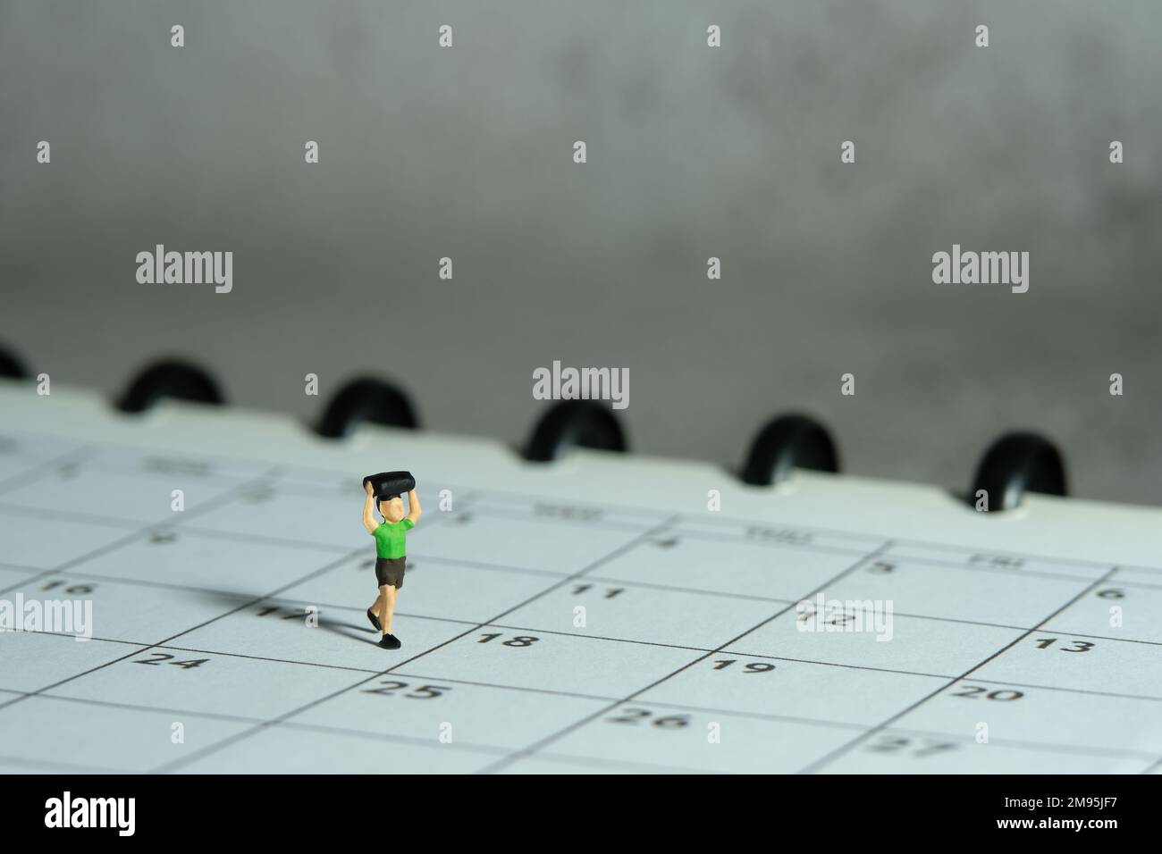 Miniature people toy figure photography. A boy running above monthly ...